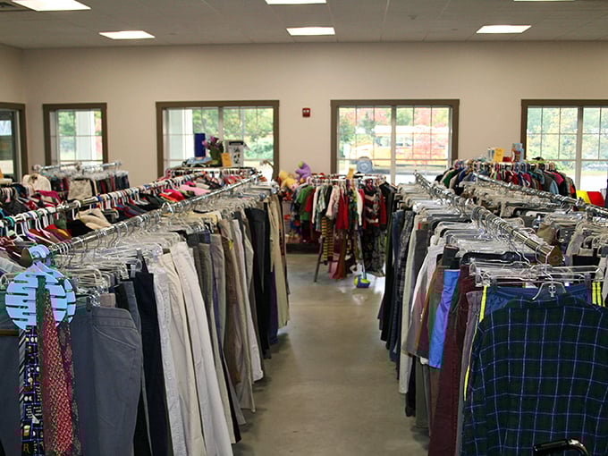 Curb appeal that rivals boutique shops! Vibrant flower beds and welcoming columns frame this thrifter's paradise in White River Junction.