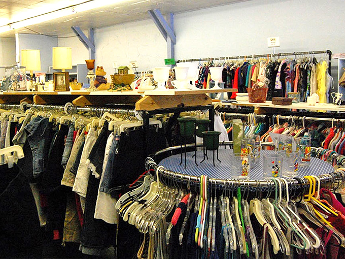 Circular racks create a thrifter's paradise where one person's castoffs become another's fashion statement. The hunt begins!
