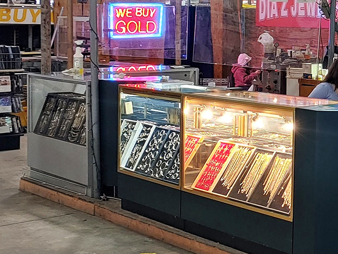 Glittering under neon lights, these jewelry cases hold stories in gold and silver, waiting for someone to continue their narrative.