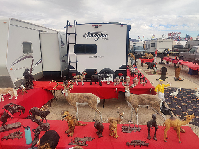 Someone's RV doubles as a wildlife museum gift shop, because nothing says "desert flea market" like plastic deer and dinosaurs.