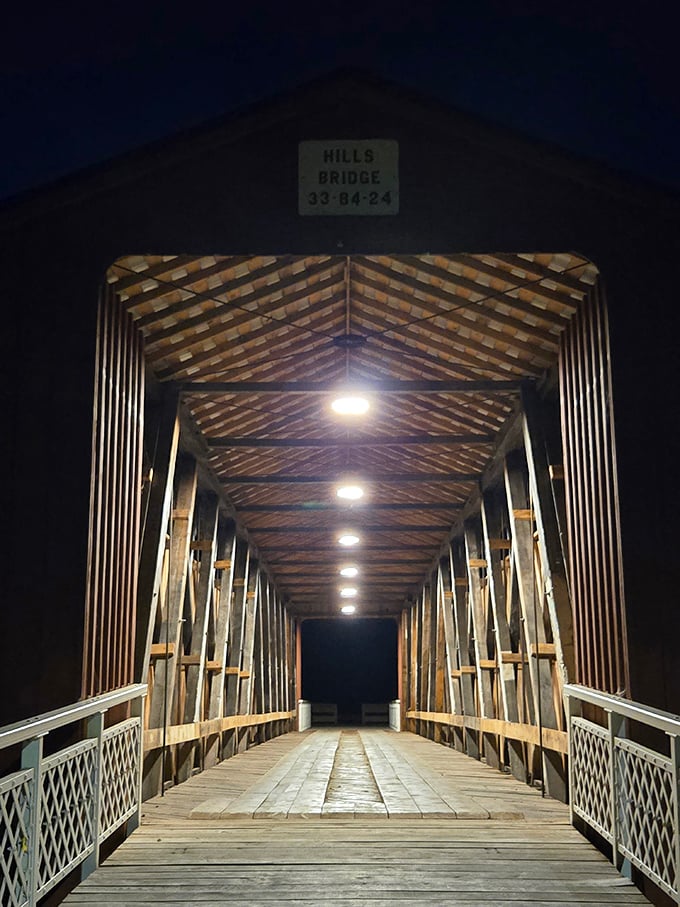 At night, the bridge transforms into something magical—like a time tunnel illuminated by modern lights guiding you through centuries of Ohio history.