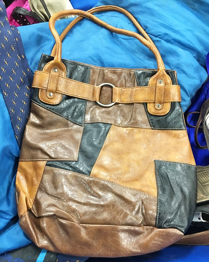Someone's castoff becomes another's statement piece. This patchwork leather bag could be your next conversation starter for pennies on the dollar.