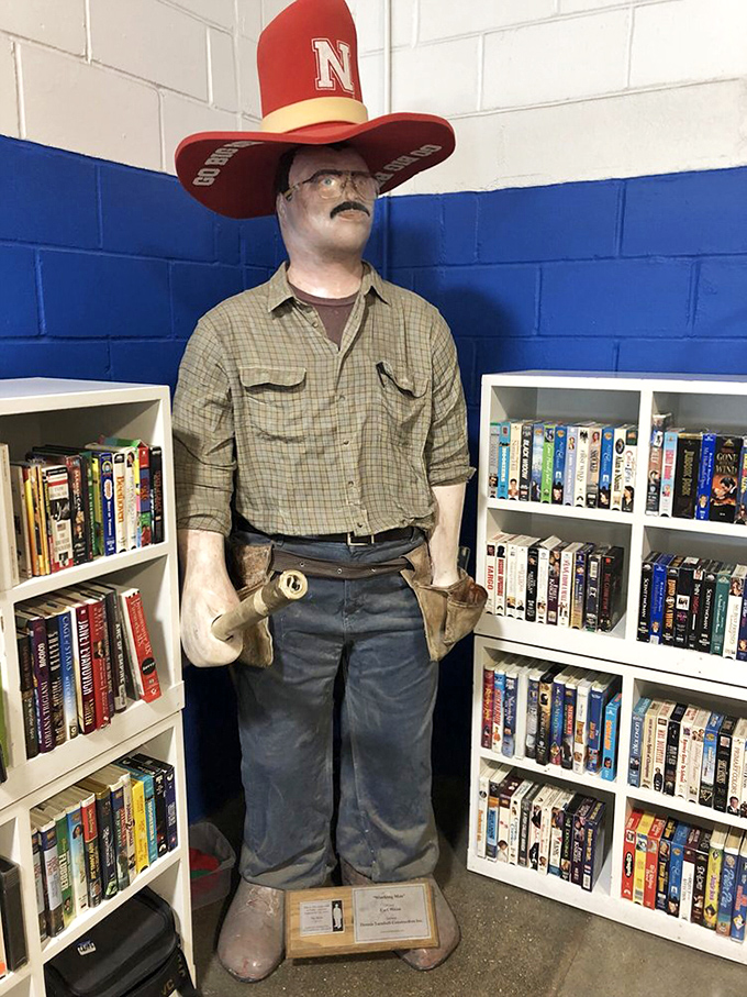 This mannequin sporting a Cornhusker hat guards the book section with stoic determination. He's seen things, this silent sentinel of secondhand literature.