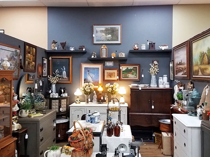 This elegantly staged vignette feels like walking into your stylish grandmother's living room, if she had impeccable taste and a penchant for blue accent walls.