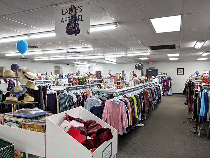 Racks upon colorful racks create a textile rainbow. That blue balloon isn't celebrating&mdash;it's marking where someone found last week's jackpot.