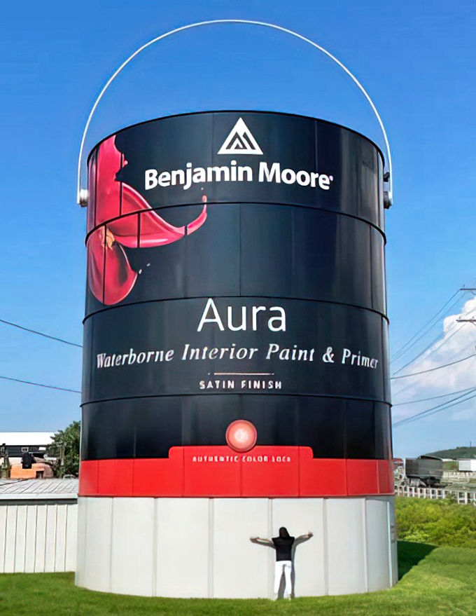 "I came, I saw, I was completely dwarfed." This massive paint container makes even grown adults look like they've shrunk in the wash.