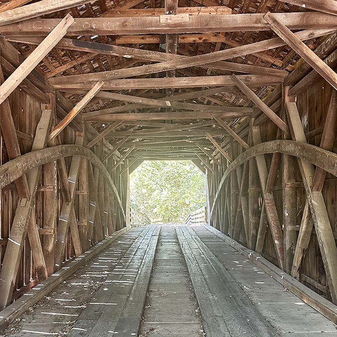 Inside the bridge, centuries-old timber creates a cathedral-like geometry of beams and trusses&mdash;engineering poetry from a pre-digital age.
