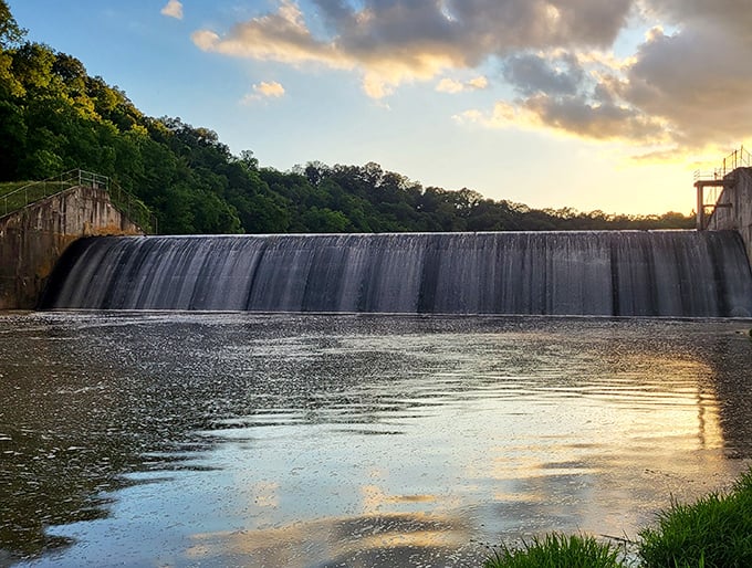 The dam at sunset creates nature's most mesmerizing infinity pool, where water cascades in hypnotic rhythm.
