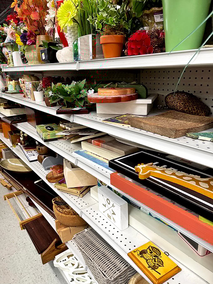A botanical bonanza meets craft corner. This shelf holds everything from faux flowers to picture frames&mdash;Martha Stewart would call this aisle "possibility central."