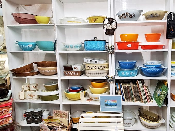 The colorful Pyrex paradise! These aren't just bowls; they're your grandmother's kitchen memories arranged by color like a mid-century rainbow of culinary nostalgia.