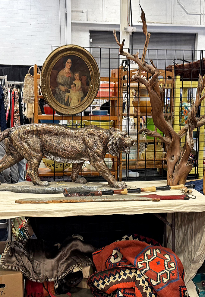 Where else can you find a silver tiger, antique portrait, and driftwood sculpture all sharing the same table? Only at The Big Flea.