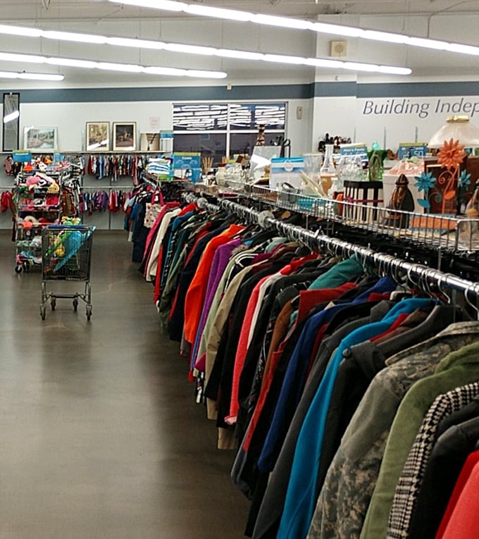Rainbow rivers of fabric flow through the store. Each garment holds a story, waiting for its next chapter to begin.