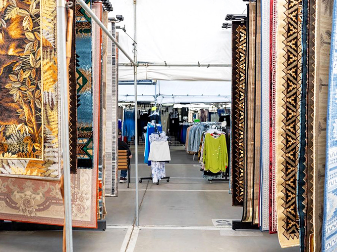 Peek between these ornate rugs and you'll find pathways to clothing treasures &ndash; retail archaeology at its finest.