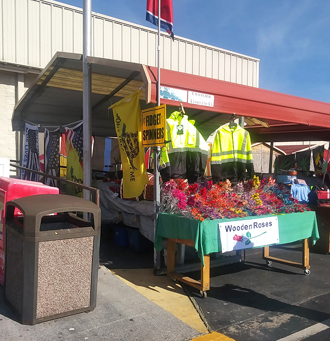 Neon safety vests meet colorful wooden roses—proof that at a good flea market, practical necessity lives right next door to whimsical indulgence.