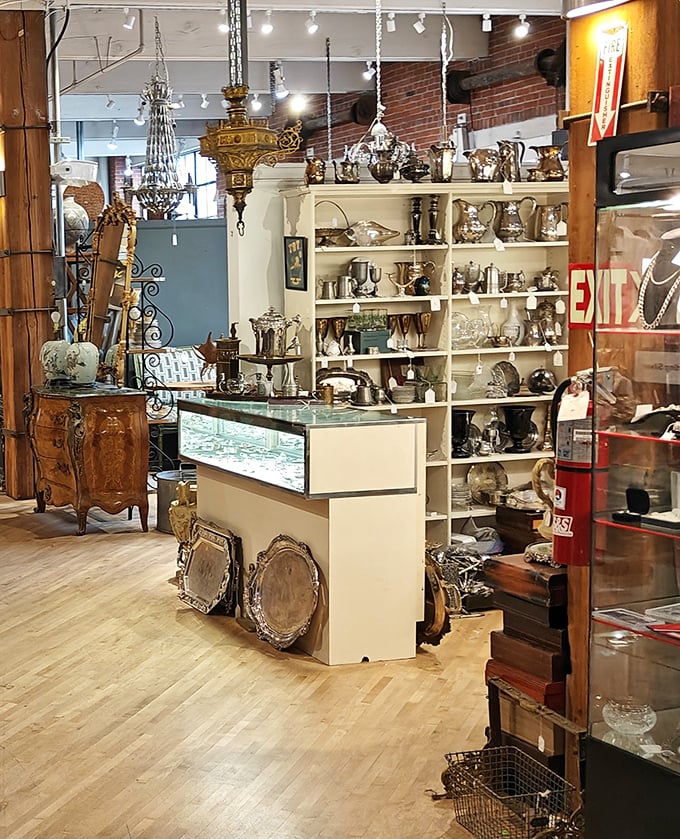 This isn't just a display case; it's a silver-plated time capsule where your grandmother's wedding gifts mingle with treasures worthy of Downton Abbey.