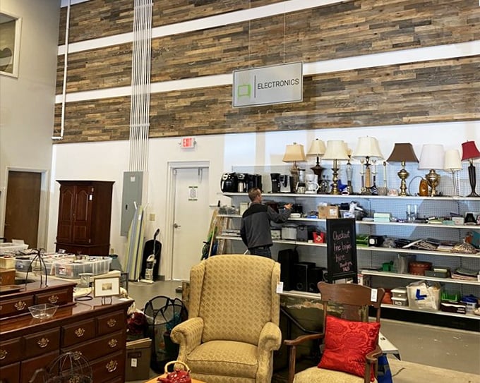 The electronics section stands tall with its accent wall, where yesterday's gadgets and today's lamps create a tech-meets-homey vibe.