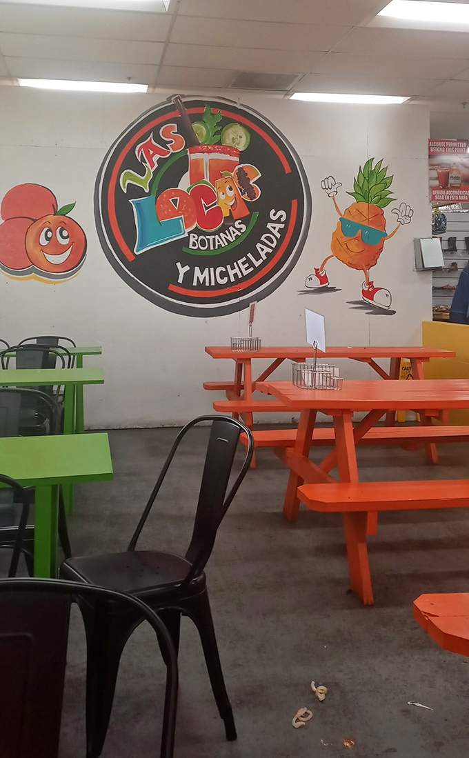 Las Locos Botanas y Micheladas brings vibrant colors and cheerful fruit mascots to the market's dining scene. That pineapple looks ready for a beach vacation!