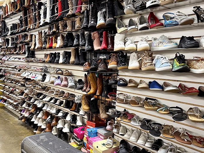 This wall of shoes tells a thousand stories, each pair waiting for feet that appreciate a good bargain.