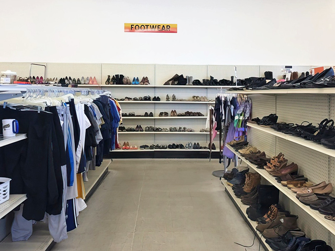 The footwear section: where practical work boots and forgotten prom shoes live in democratic harmony, all waiting for their second dance.