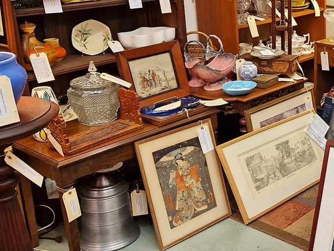 Vintage treasures stacked with care &ndash; where Japanese prints meet crystal candy dishes in the delightful chaos that is antique shopping.