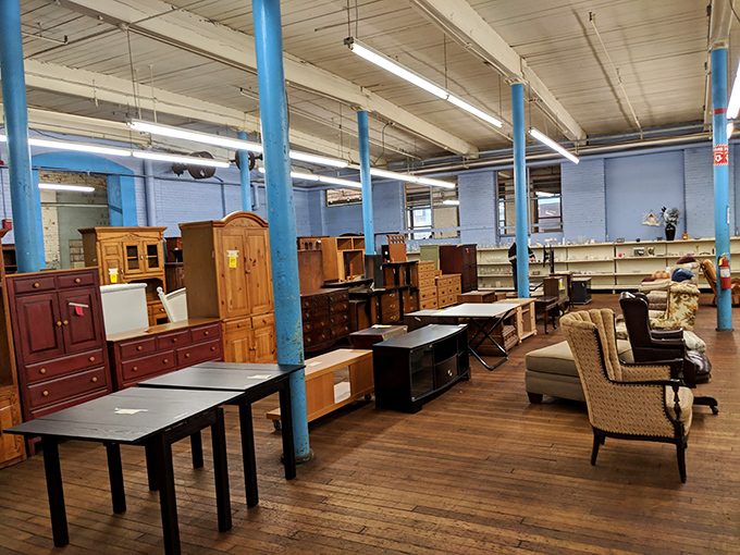 The furniture section showcases solid craftsmanship from eras when things were built to last. That blue-painted column has witnessed countless bargain victories.
