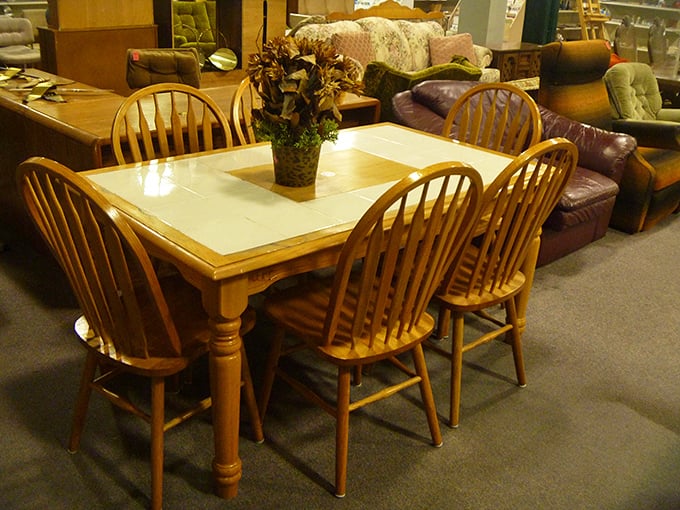 Solid wood dining sets that have already weathered countless family gatherings stand ready for their next chapter of dinner conversations and holiday meals.