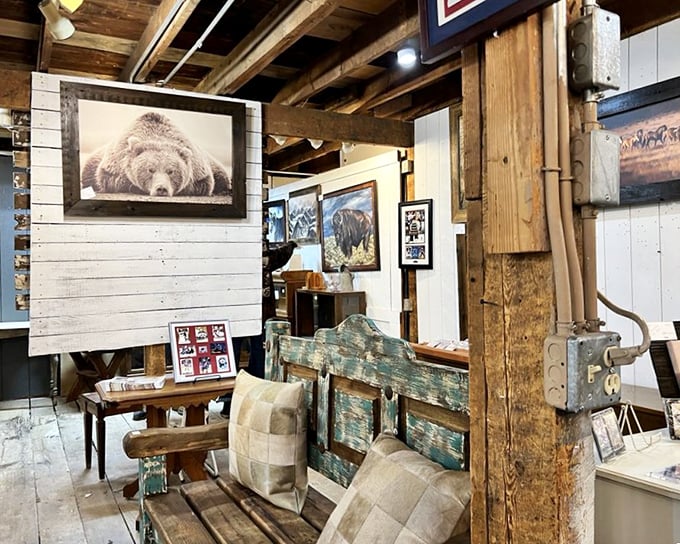Rustic wooden beams frame wildlife photography and weathered furniture, creating the perfect backdrop for Colorado's mountain aesthetic.