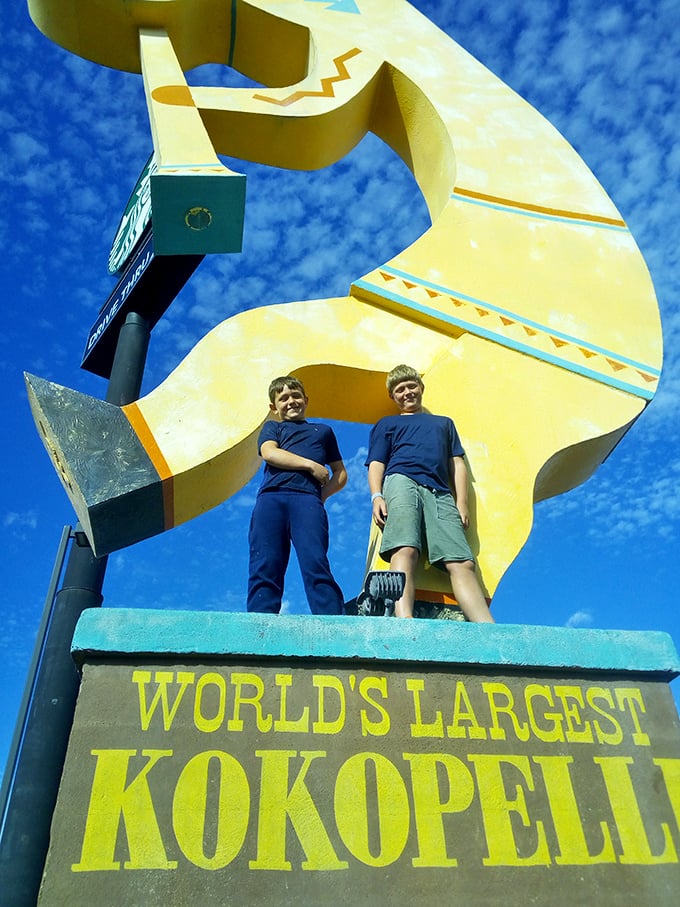 "Mom, can we measure how many kids tall this thing is?" The Kokopelli provides both entertainment and an impromptu math lesson.