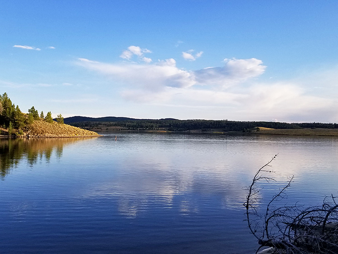 Mirror-like waters create nature's perfect reflection pool, proving that Steamboat Lake doesn't need Instagram filters to look this good.