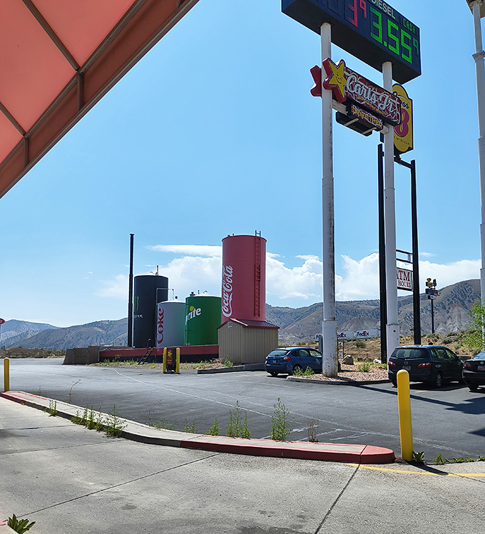 The Cowboy's Travel Stop sign promises gas and snacks, but delivers an unexpected pop culture monument that's impossible to miss.