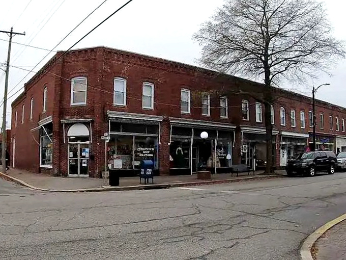 Historic brick buildings line Denton's main thoroughfare, housing local businesses where your dollar stretches further than your retirement dreams.