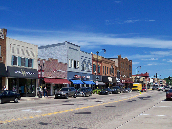 Main Street stretches before you with historic brick buildings and modern possibilities, the heart of a town that beats at human scale.