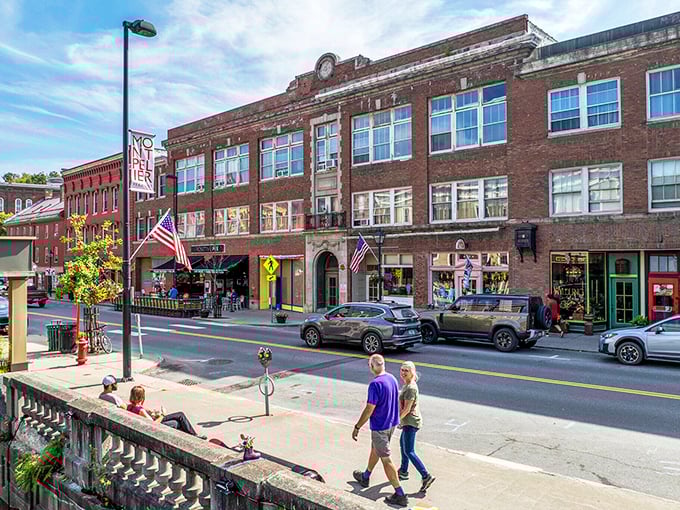 Sunlight warms a historic brick street where you can stroll past charming shops and enjoy a relaxing afternoon in town.
