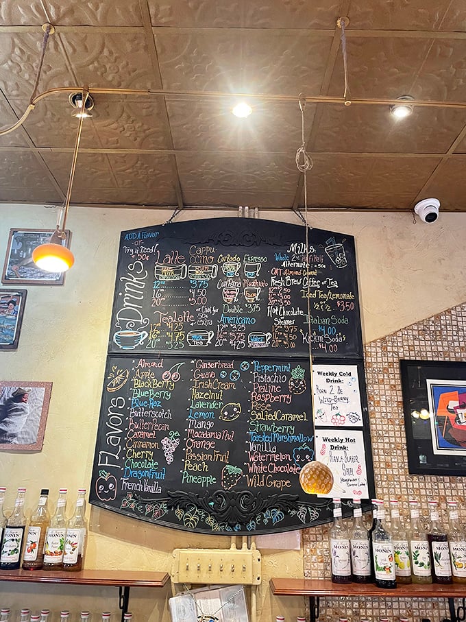 The chalkboard menu reads like a passport to flavor country, with coffee concoctions and syrup flavors to customize your bakery experience.