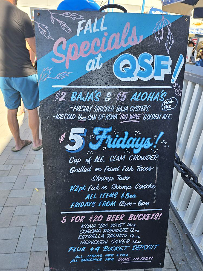 The chalkboard menu at QSF reads like poetry to seafood lovers. Friday specials that make you wish every day was the end of the workweek.