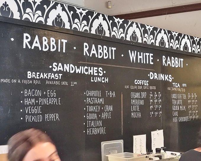 The menu board speaks the universal language of sandwich diplomacy. Ham and pineapple for breakfast? That's the kind of morning rebellion I can support.