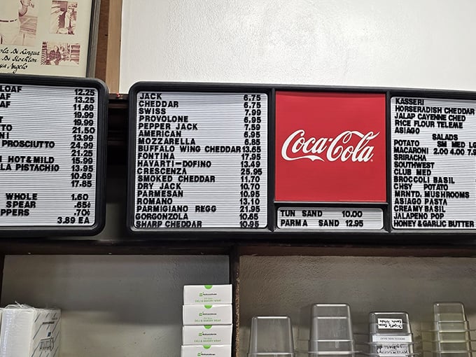 This menu board is like a family tree of cheese possibilities. The Coca-Cola sign provides a familiar landmark in this sea of Italian delights.