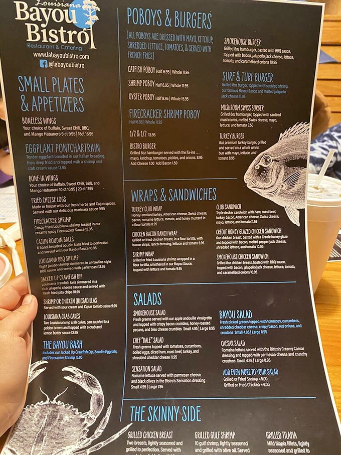 This menu reads like a love letter to Louisiana cuisine, offering everything from boudin balls to shrimp wraps in one place.