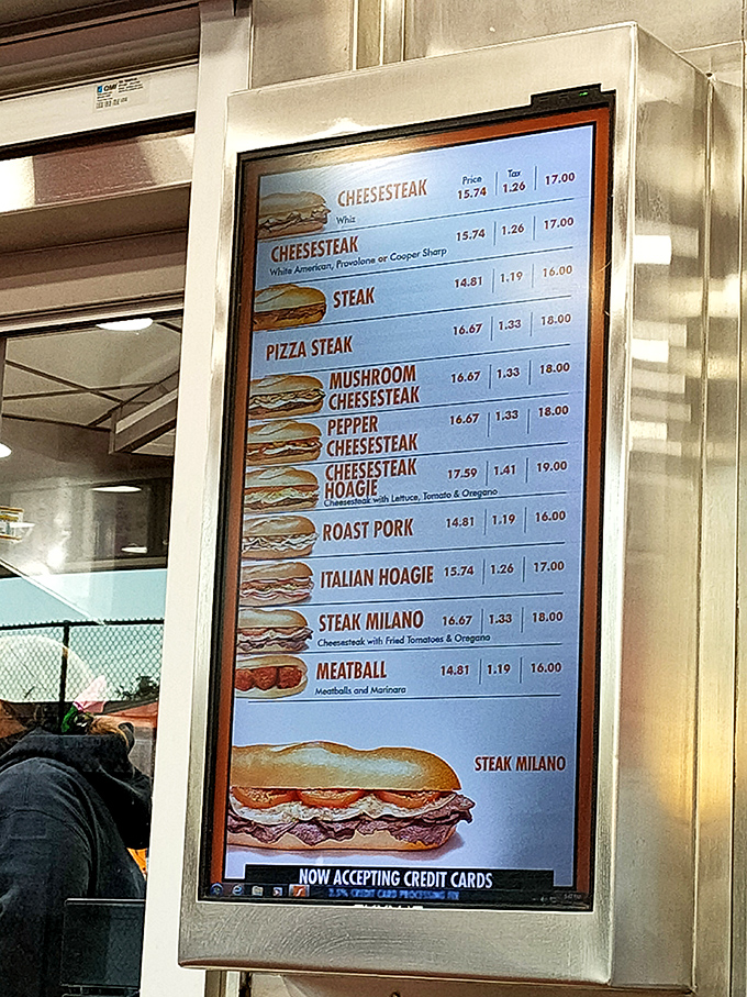 Life's important decisions illuminated on a digital menu board. Each sandwich option promises a different path to Philadelphia happiness.