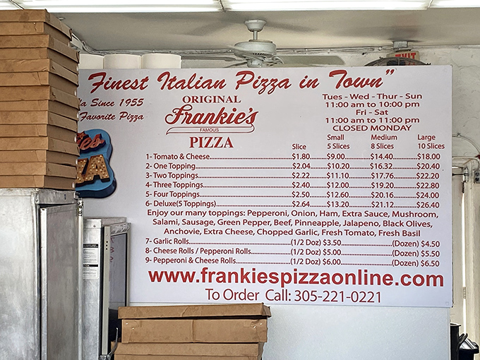 The menu board tells you everything you need to know&mdash;no QR codes, no seasonal chef's specials, just timeless pizza perfection that hasn't needed updating for decades.