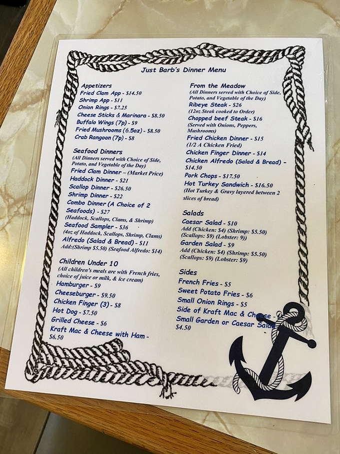 The menu, bordered by nautical rope and an anchor, reads like a love letter to Maine's coastal bounty&mdash;seafood takes center stage.