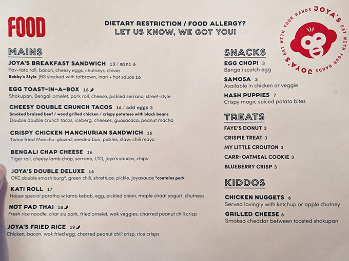 A menu that reads like a global breakfast adventure. Each item promises a journey worth taking, especially that breakfast sandwich calling your name.