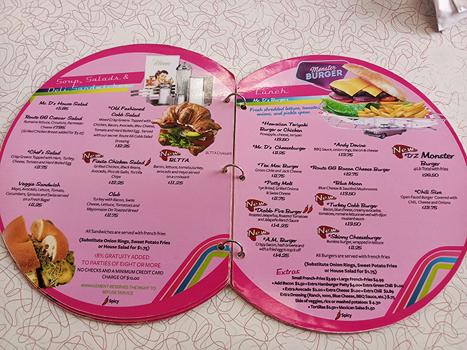 The circular menu is as colorful as the diner itself, offering everything from burgers to salads in a design that makes ordering feel like spinning a wheel of delicious possibilities.