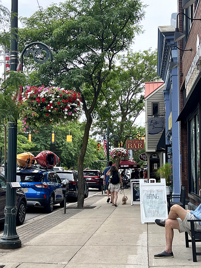 Summer strolling at its finest. Those hanging flower baskets aren't just decorations&mdash;they're Charlevoix's version of a red carpet welcome.