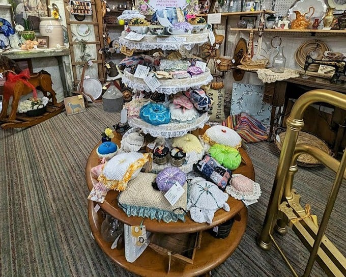 Grandma's sewing supplies meet artful display. These pincushions aren't just practical—they're tiny textile museums waiting for their forever home.