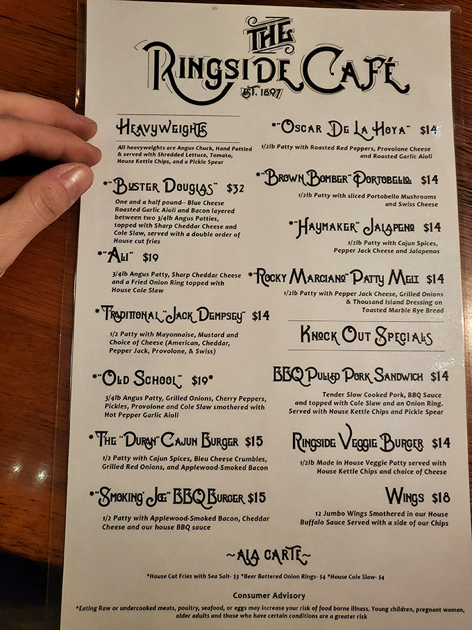 The menu reads like a boxing card of champions, each burger waiting for its chance to deliver a knockout punch to your taste buds.