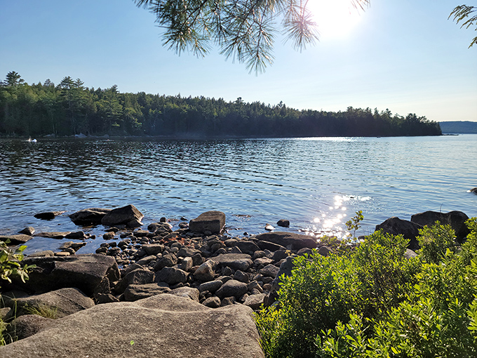 Nature's own infinity pool where Sebec Lake meets rocky shore. The sun-dappled water practically begs you to skip a stone or dip your toes.