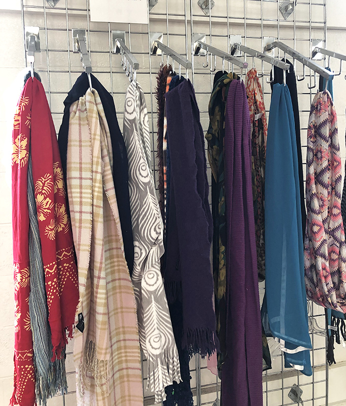 A rainbow of scarves tells stories of previous lives—that red paisley number definitely attended Woodstock, while the plaid one had tea with the Queen.