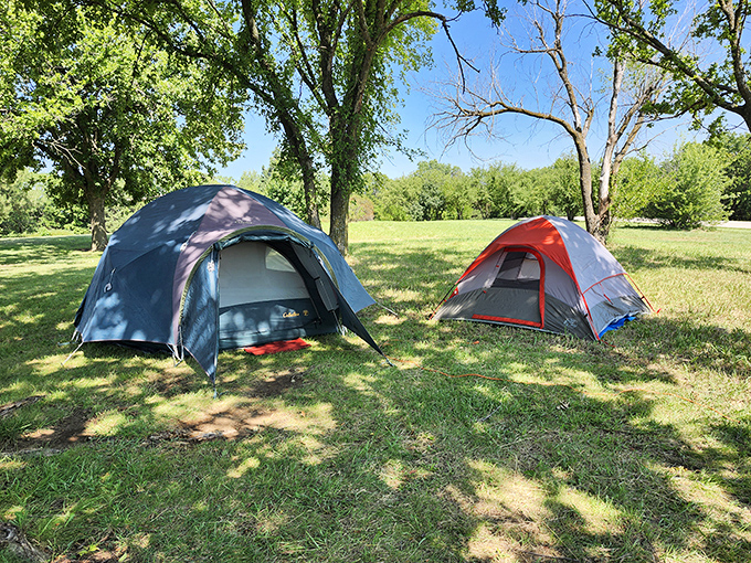 Camping simplified: two tents, endless sky, and shade that's worth more than gold during Kansas summers. Nature's five-star accommodations await.