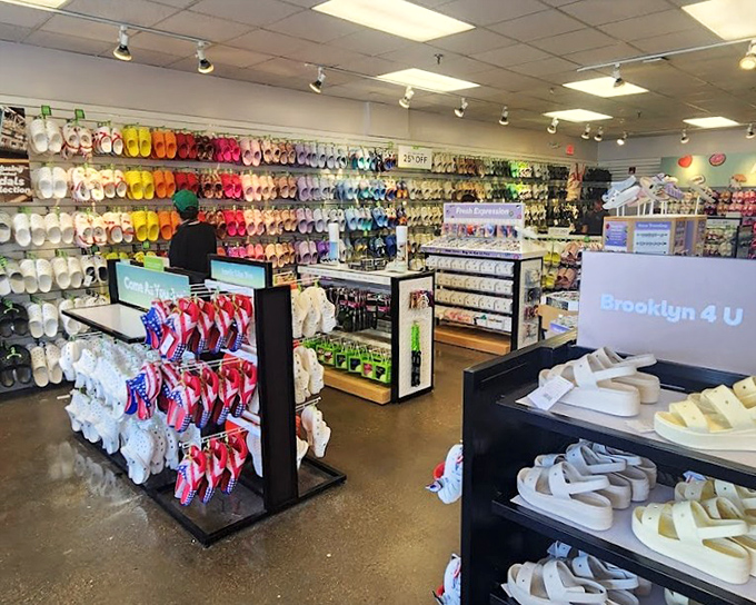 A rainbow explosion of flip-flops and summer footwear creates a kaleidoscope of color that makes choosing just one pair mathematically impossible.